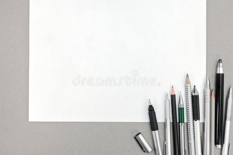 Blank Paper Sheet with Pens and Pencils on Office Table Stock Photo ...