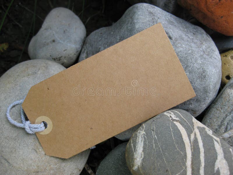 Blank paper tag on stones stock image. Image of nature - 31564697