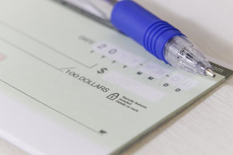 A Blank Personal Cheque with a Pen Stock Photo - Image of office ...