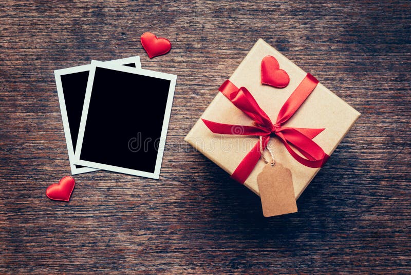 Blank Photo Frame and Gift Box with Red Heart on Wood Background Stock ...