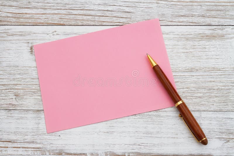 Blank Pink Greeting Card with Pen on Wood Stock Photo - Image of ...