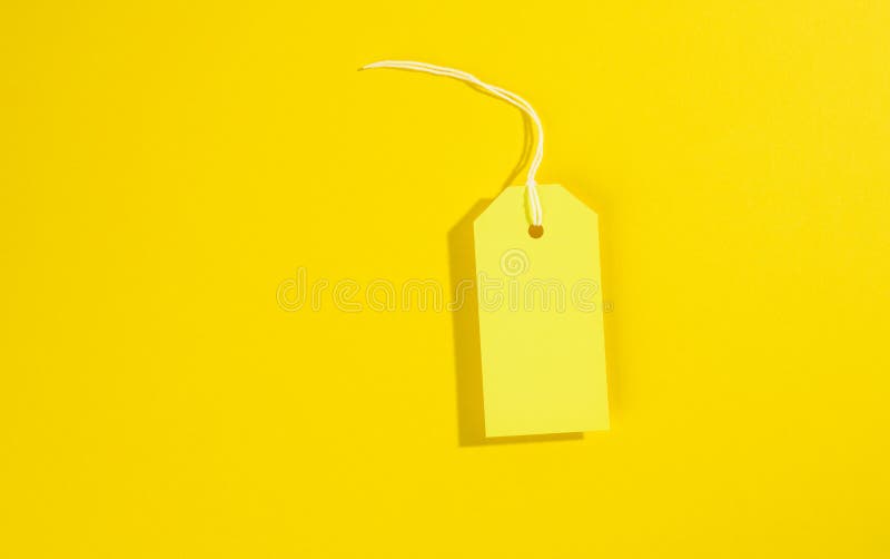 Yellow price tag on white stock photo. Image of information - 5410486