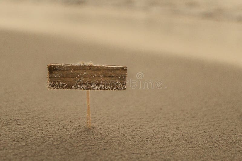 A Rectangular Wooden Sign Slightly Covered with Sand on the Desert or ...