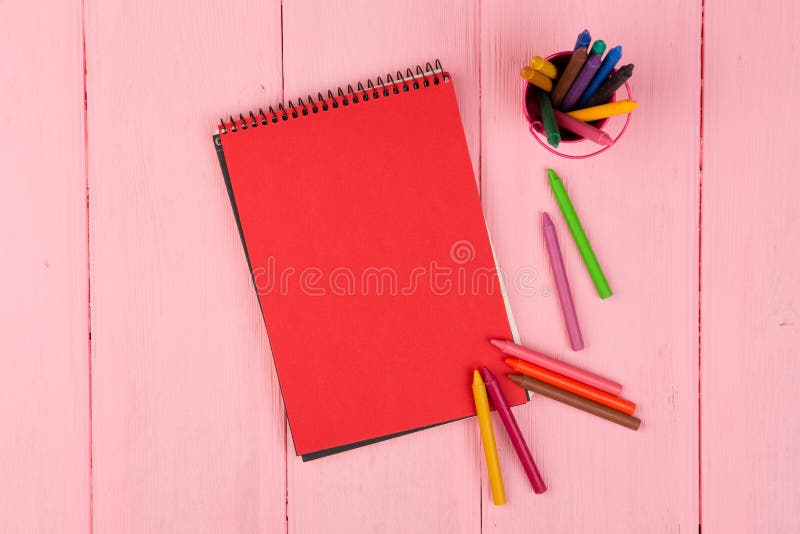 Blank Red Notepad and Crayons on Pink Wooden Table Stock Photo - Image ...