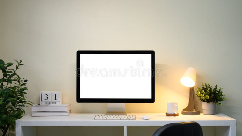 Blank Screen Desktop Computer, Calendar, Desk Lamp, and Indoor Plants ...