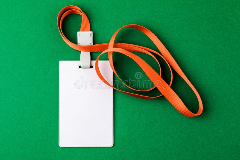 Blank Security Tag with a Red Stripe Neck on a Green Background. Place ...