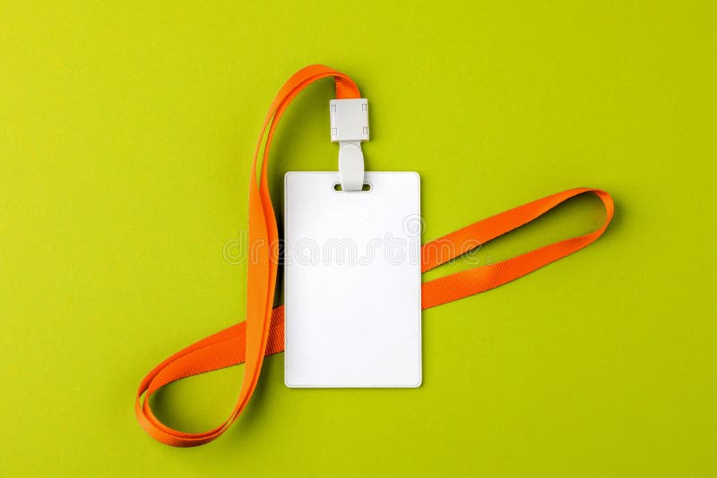 Blank Security Tag with a Red Stripe Neck on a Green Background. Place ...