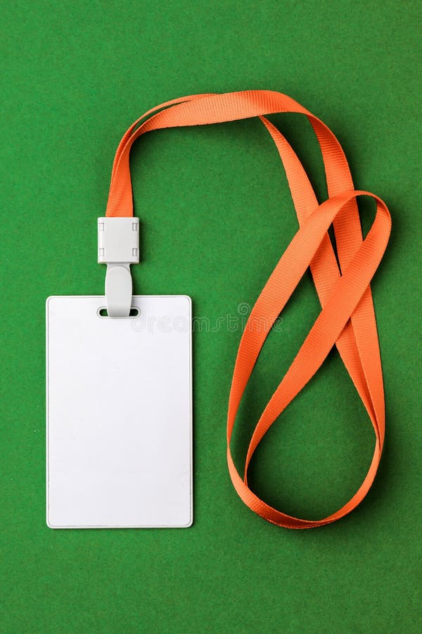 Blank Security Tag with a Red Stripe Neck on a Green Background. Place ...