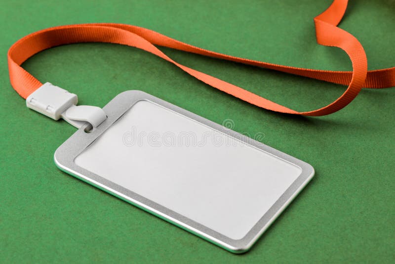 Blank Security Tag with a Red Stripe Neck on a Green Background. Place ...