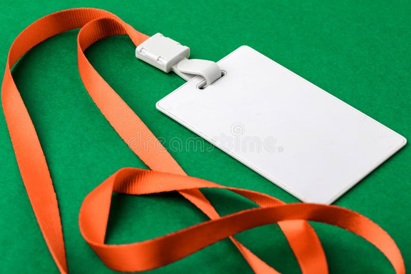 Blank Security Tag with a Red Stripe Neck on a Green Background. Place ...