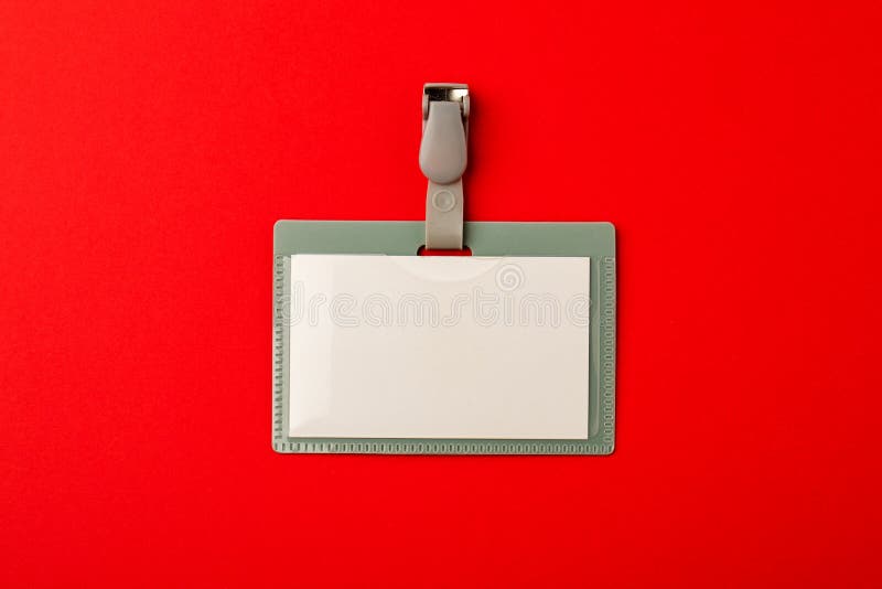 Blank Security Tag with a Red Stripe Neck on a Green Background. Place ...