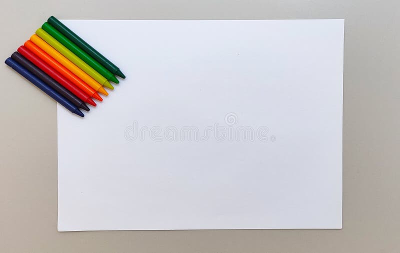 Crayons and sheet of paper stock image. Image of paper - 220879497