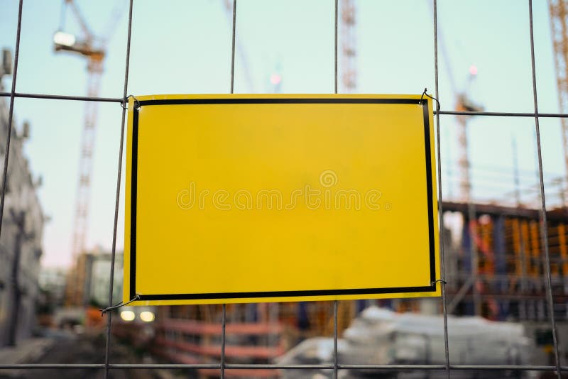 Blank Sign Hanging on Fence at Construction Site - Empty Sign Mockup ...