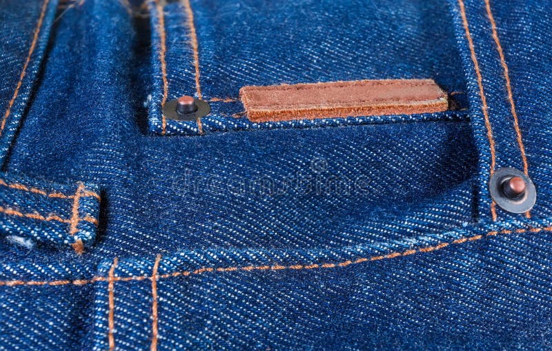 Blank Small Leather Label and Cooper Rivets on Blue Jeans Stock Photo ...