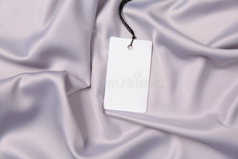 Blank Tag on Silver Silky Fabric, Top View. Space for Text Stock Photo ...