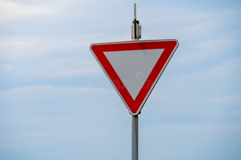 Blank Triangle Warning Road Sign Against the Blue Sky Stock Image ...
