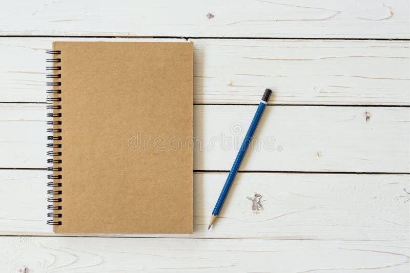 Blank Vintage Paper Notebook with Pencil on Wood Table Stock Image ...