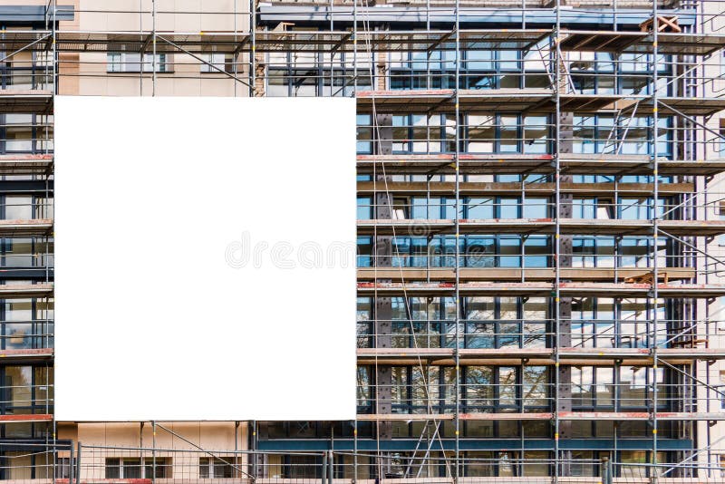 Blank White Advertisement Hanging on the Scaffolding of Modern Building ...