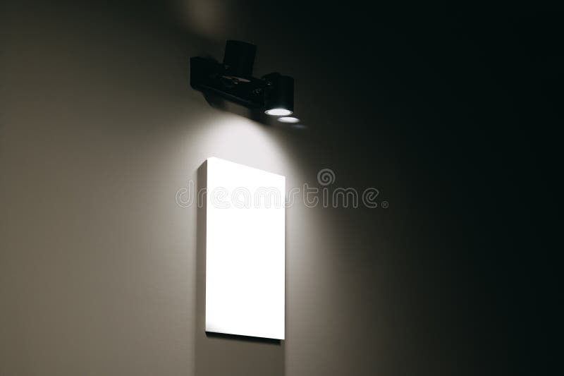 Blank White Canvas on a Grey Wall Lighted by a Wall Black Modern Spot ...