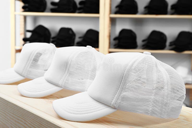 Blank White Caps on Wooden Table in Store Stock Image - Image of ...