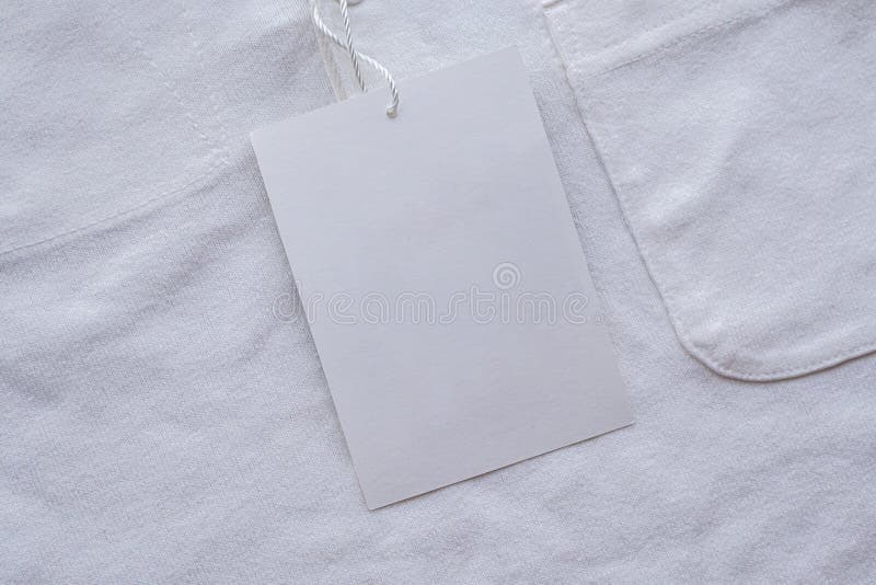 Blank White Clothes Tag Label on New Shirt Stock Photo - Image of ...