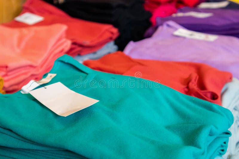 Blank White Clothes Tag on New Shirt in Store Stock Photo - Image of ...