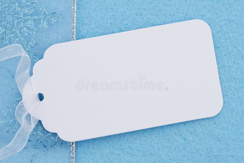Blank White Gift Tag on Blue Felt Stock Photo - Image of gift, paper ...