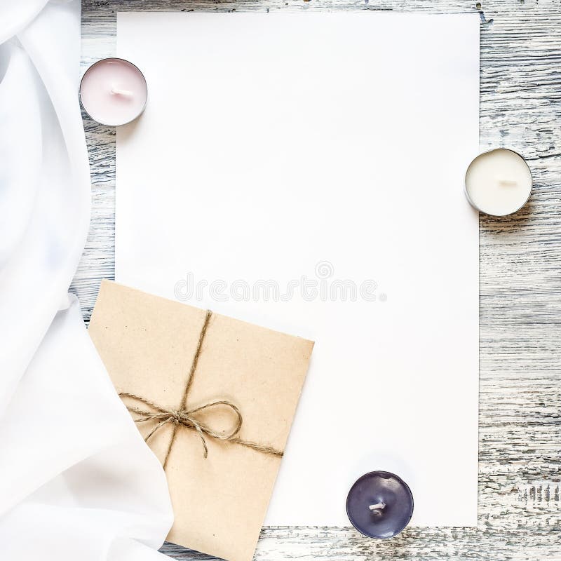 Blank White Greeting Card and Envelope with Candles Over Rustic Table ...
