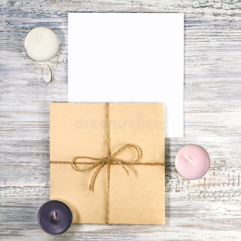 Blank White Greeting Card and Envelope with Candles Over Rustic Table ...