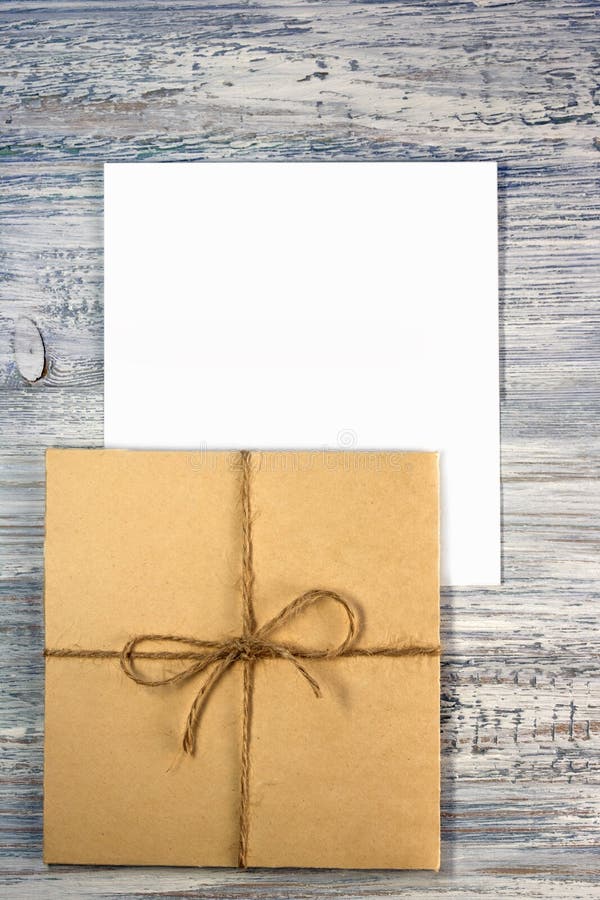 Blank White Greeting Card and Envelope Over Rustic Table with Copy ...