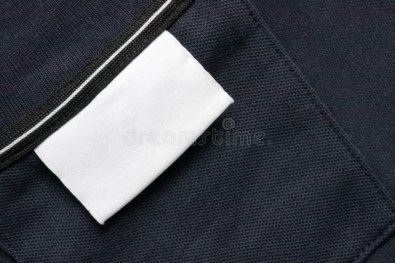 Blank Laundry Care Clothes Label on Black Shirt Fabric Texture ...