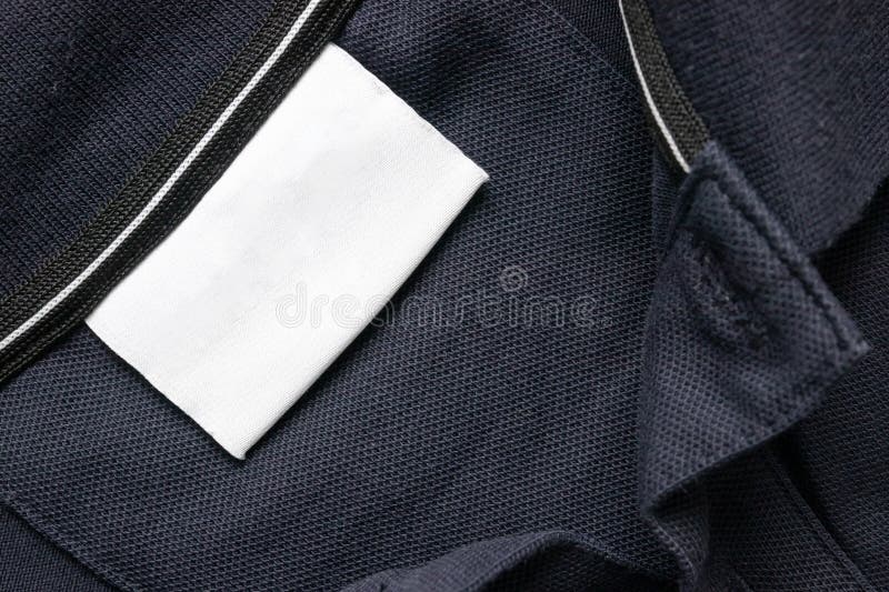 Blank White Clothing Label on Brown Fabric Texture Background Stock ...
