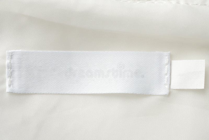 Blank White Laundry Care Clothes Label on Fabric Texture Background ...