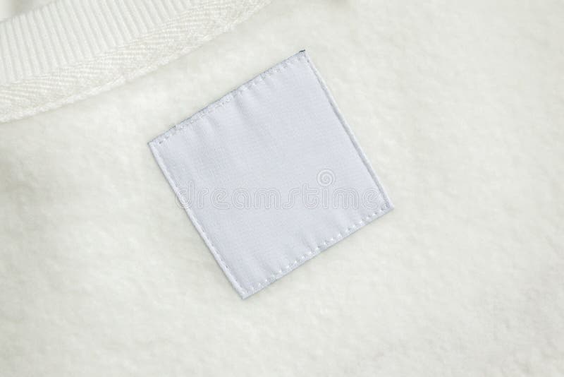 Blank White Laundry Care Clothes Label on Fabric Texture Background ...