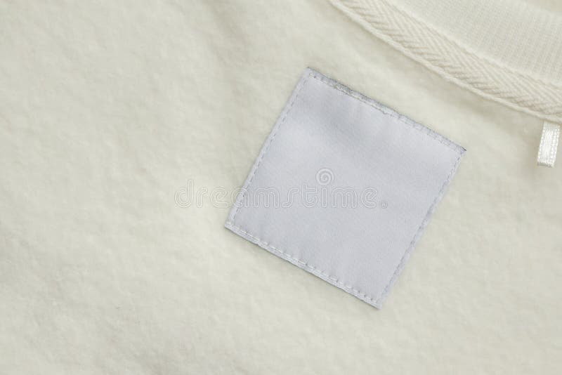 Blank White Laundry Care Clothes Label on Fabric Texture Background ...