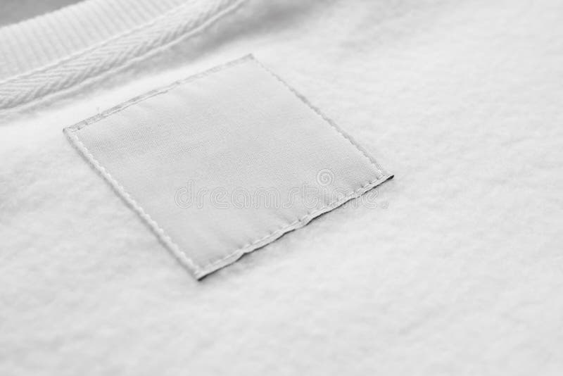 Blank White Laundry Care Clothes Label on Fabric Texture Background ...