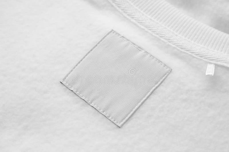 Blank White Laundry Care Clothes Label on Fabric Texture Background ...