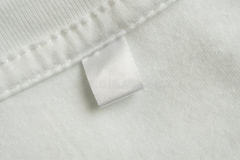 Blank White Laundry Care Clothes Label on White Shirt Fabric Texture ...