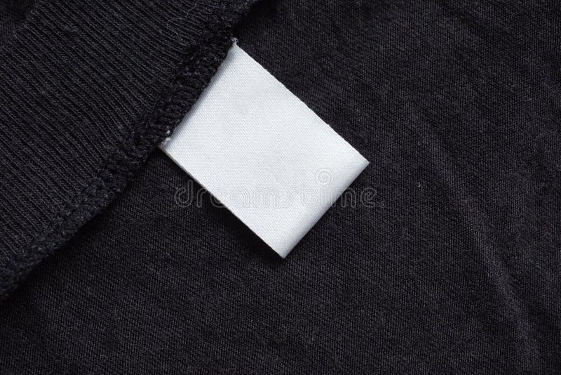 Blank White Laundry Care Clothing Label on Fabric Texture Stock Photo ...