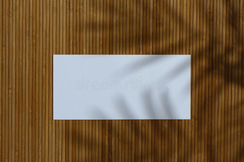 Blank White Paper Leaflet Template Displayed on Textured Bamboo Wood ...