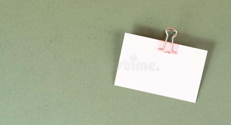 Blank White Paper with a Paperclip on a Green Colored Background, Copy ...