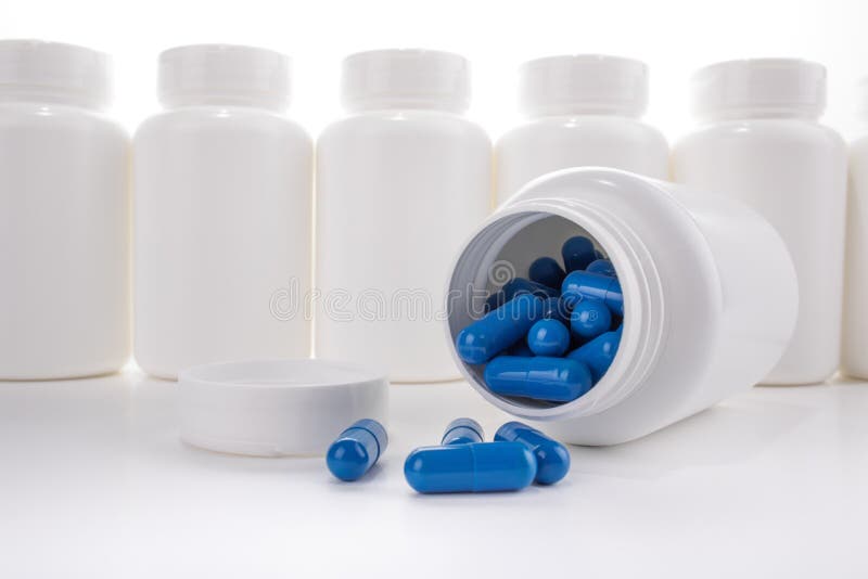 Blank White Pill Bottle Open with Generic Blue Capsule Pills on White ...