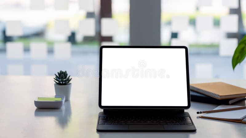 Blank White Screen of a Laptop and a Notebook Placed on the Table at ...