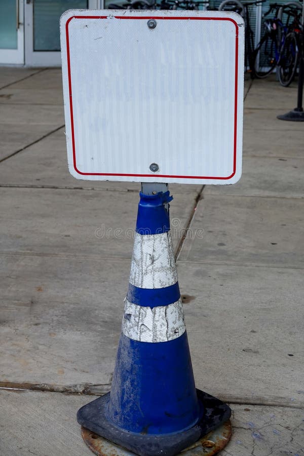 A Blank White Sign with Red Trim on an Old Blue and White Cone on a ...