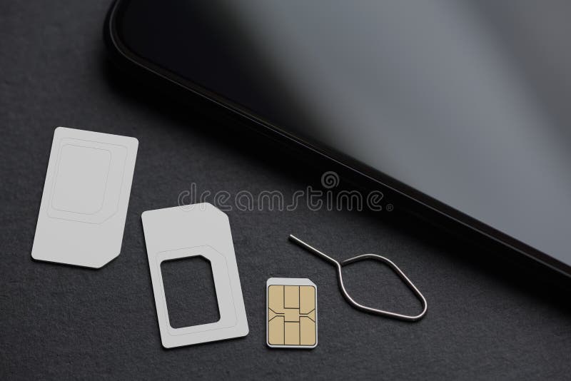 Blank White SIM Card with Smartphone on Black Slate. 3D Rendering and ...