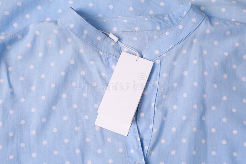 Blank White Tags on Light Blue Shirt with Polka Dot Pattern, Top View ...