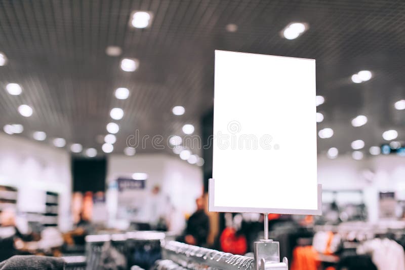 Blank White Vertical Sign in Blurred Clothing Store Stock Image - Image ...