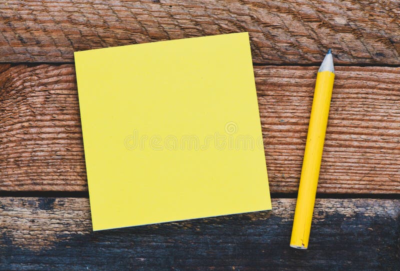 Blank Yellow Memo Card and Yellow Pencil on a Wooden Table. a Blank ...