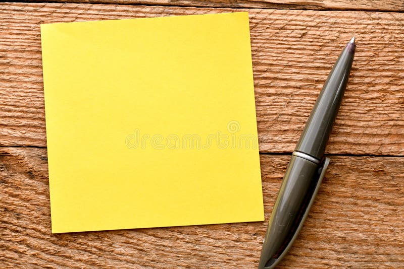 Blank Yellow Memo Card and Yellow Pencil on a Wooden Table. a Blank ...