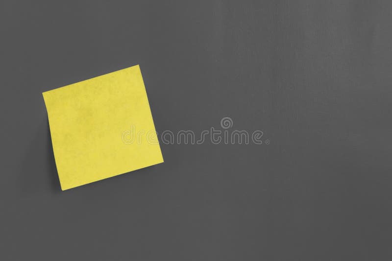 A Blank Yellow Sticky Note with Copy Space on a Gray Background Stock ...